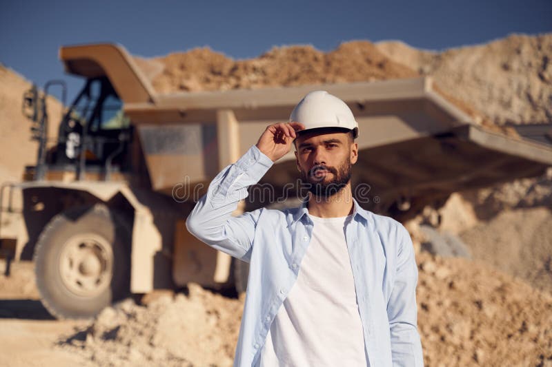 Posing for a Camera. Man in Uniform is Working in the Quarry at Daytime ...