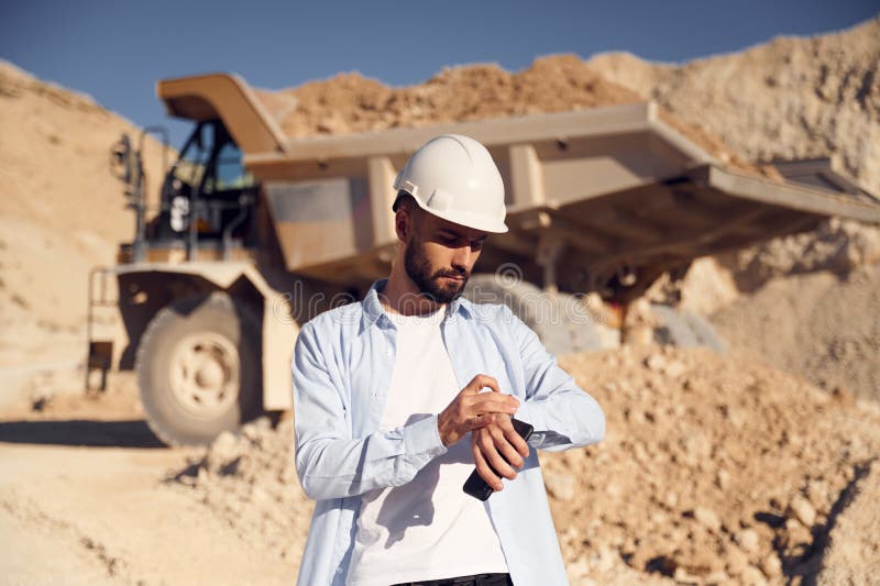 Posing for a Camera. Man in Uniform is Working in the Quarry at Daytime ...