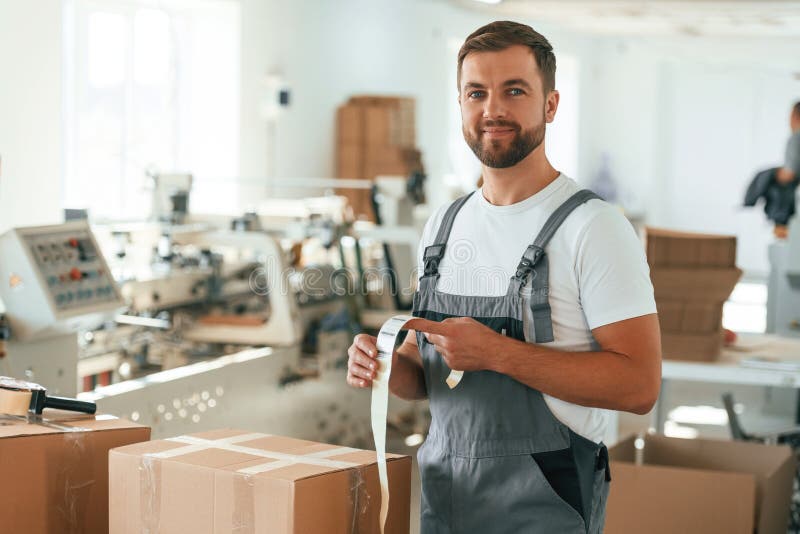 Posing, Cheerful Male. Handsome Man is Working at the Factory of ...