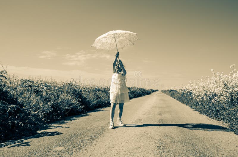 Posing with parasol stock image. Image of childhood - 143930561