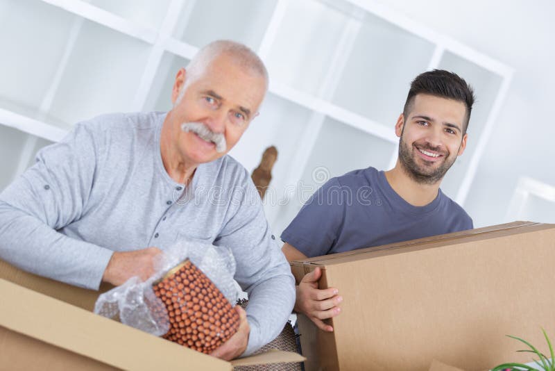 Posing and Smiling while Packing Stock Image - Image of employment ...