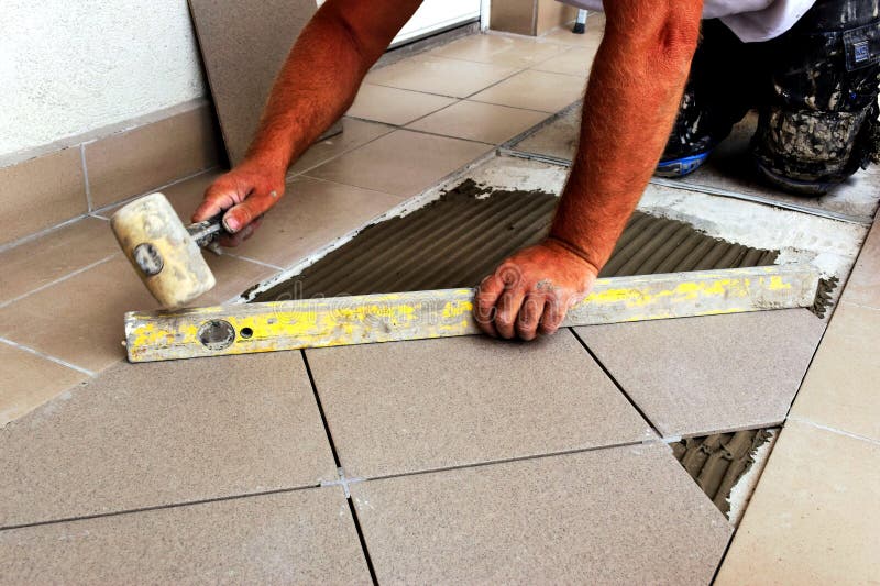 Positioning Large Ceramic Floor Tiles during Flooring Installation with ...