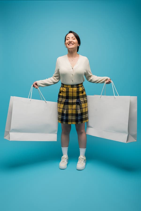 Positive Asian Woman Holding Shopping Bags Stock Image Image Of