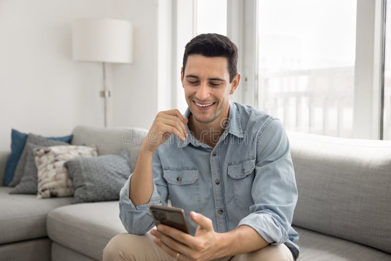 Positive Attractive Hispanic Smartphone User Man Reading Text Message ...