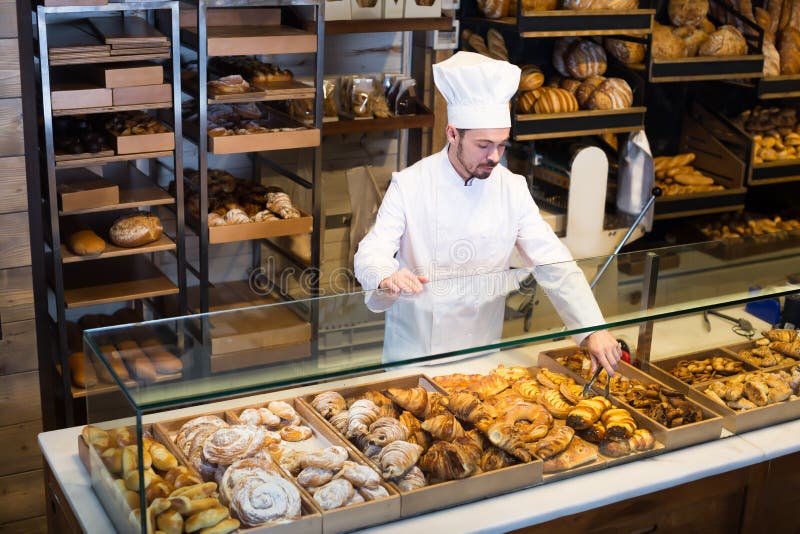 Positive Baker Showing Assortment of Bakery Stock Photo - Image of ...