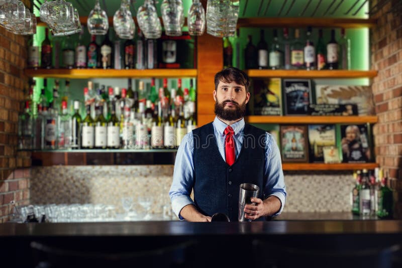 Positive Barkeeper Standing at Counter Stock Photo - Image of beard ...