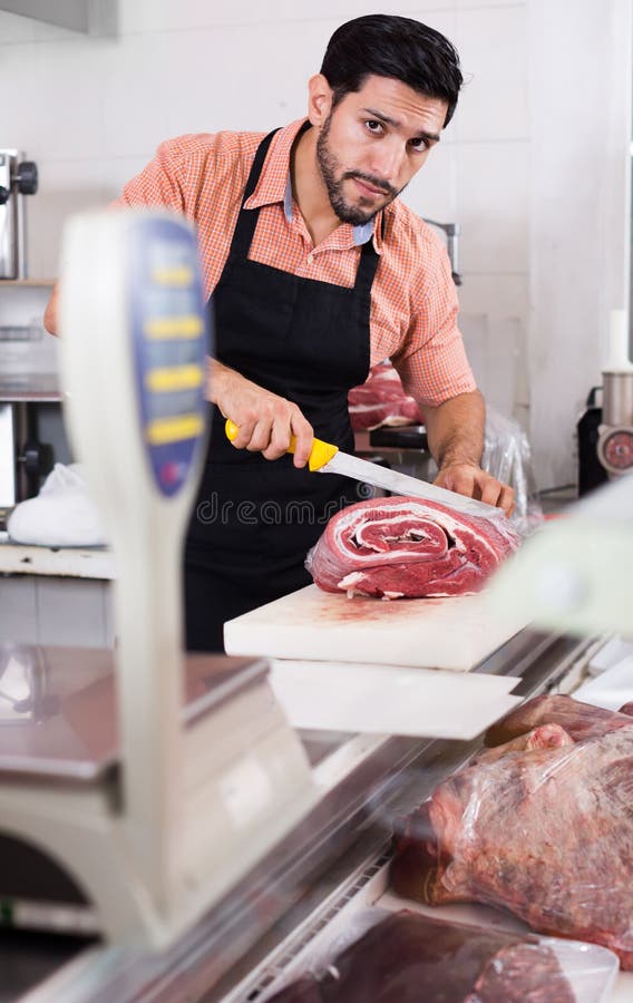 Positive Butcher is Cutting Meat for Clients Stock Photo - Image of ...