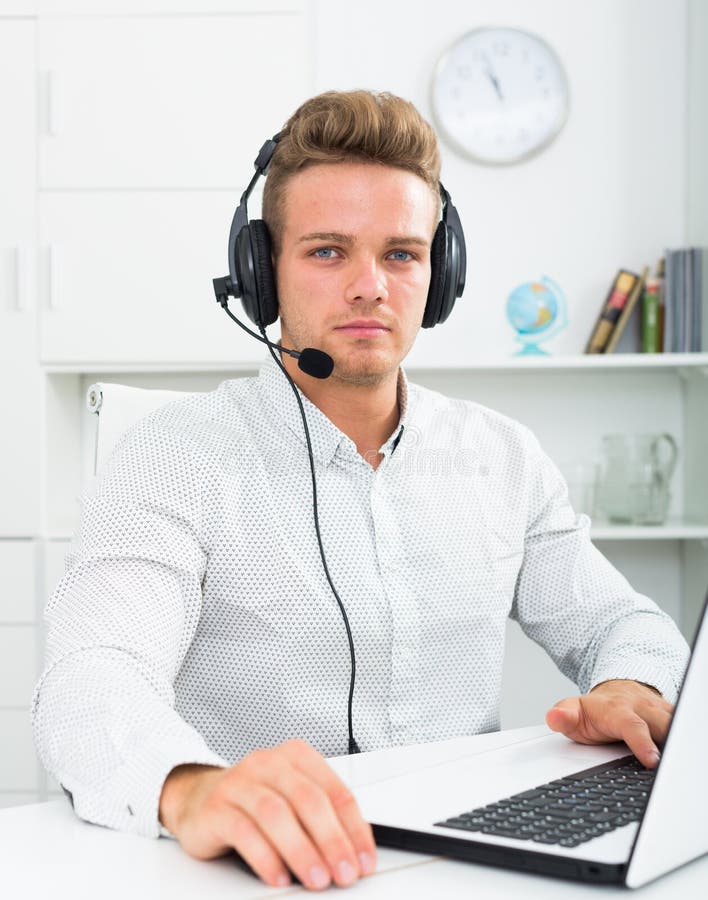 Young Man Working in Call Centre Stock Image - Image of device, call ...