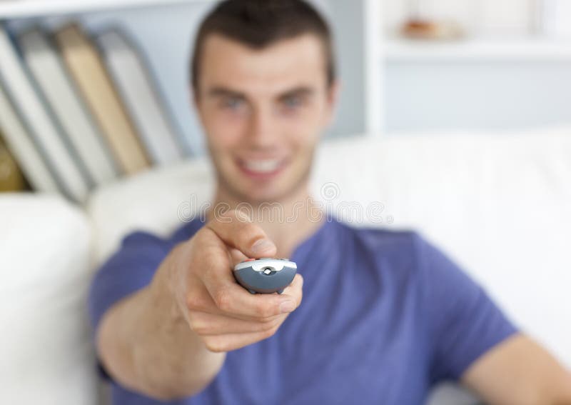 Positive Caucasian Man Holding a Remote Stock Photo - Image of charming ...