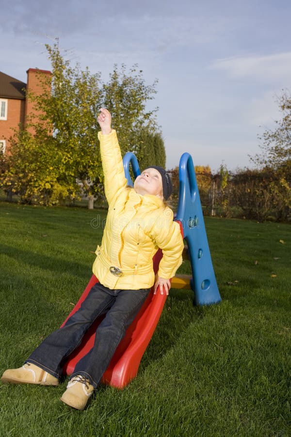 Smiling Positive Child Sit Under Slide on Grass Stock Image - Image of ...