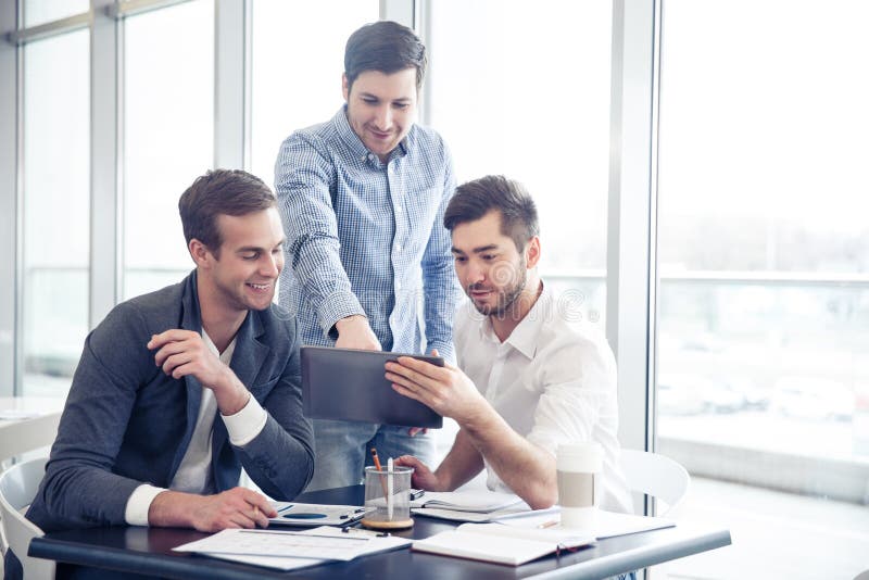 Positive Colleagues Discussing Project Stock Image - Image of pleasant ...