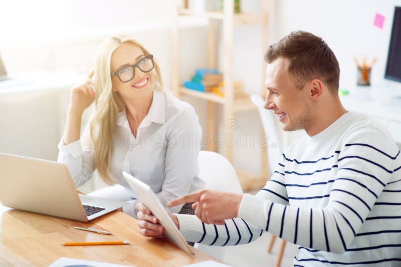 Positive Colleagues Discussing a Project Stock Image - Image of ...