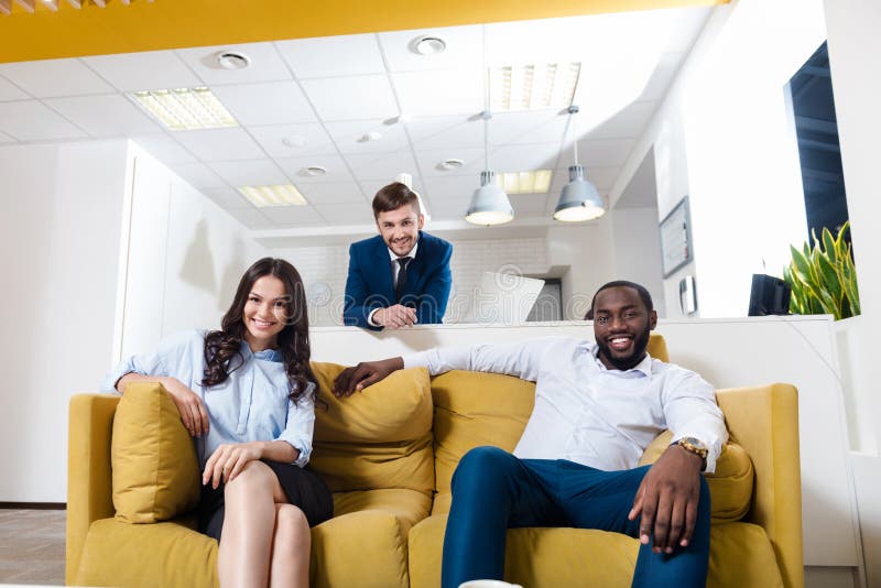 Positive Colleagues Sitting in the Office Stock Image - Image of ...