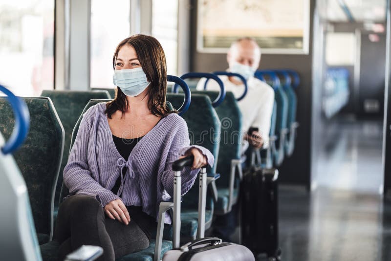 Positive Commuters Wearing Mask Enjoying Their Train Trip Stock Photo ...