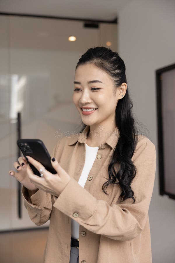 Positive Confident Young Asian Businesswoman Using Inline Communication Technologies Stock Photo ...
