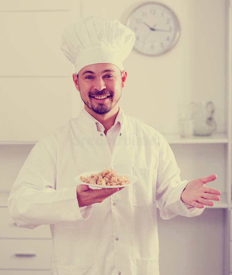 Positive Cook with Porridge Stock Image - Image of offering, clock ...