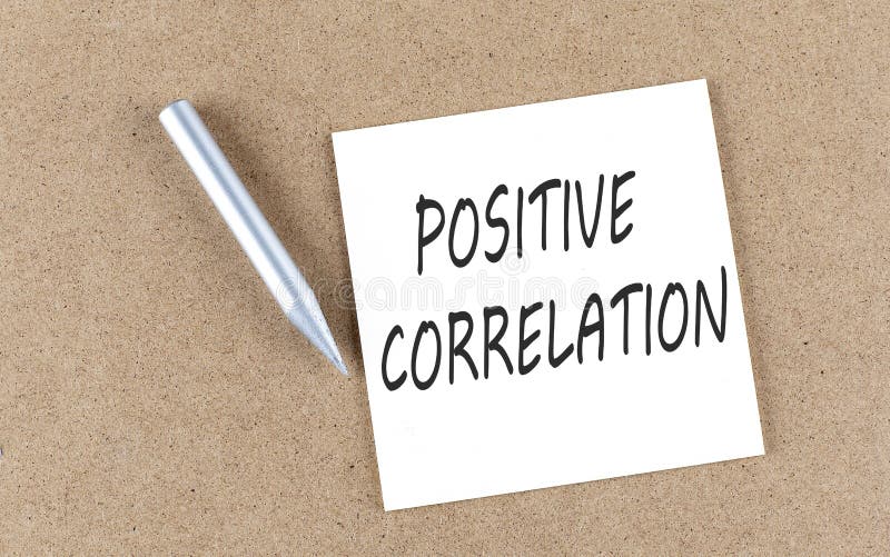 POSITIVE CORRELATION Text on a Sticky Note on Cork Board with Pencil ...