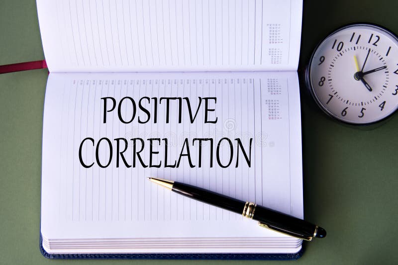 POSITIVE CORRELATION - Words in a White Notebook on a Dark Green ...