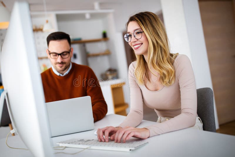 Positive Couple Having Fun while Working Together Remotely at Home ...