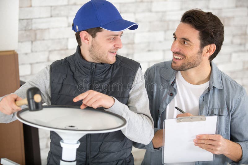 Positive Craftsman with Apprentice Working on Chair Stock Photo - Image ...