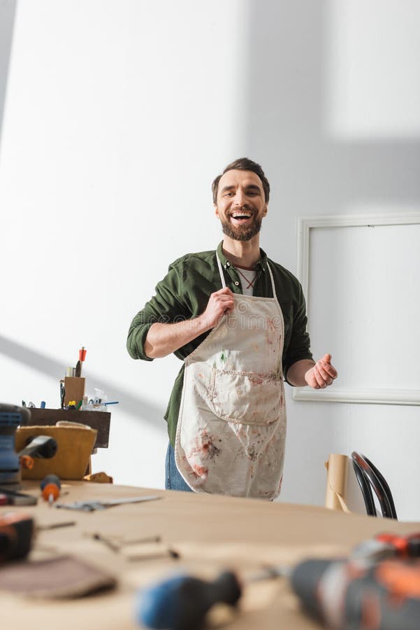 Positive Craftsman in Dirty Apron Standing Stock Photo - Image of happy ...