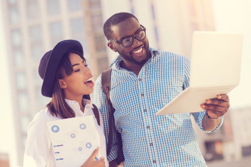 Positive Delighted Students Looking at the Netbook Screen Stock Photo ...