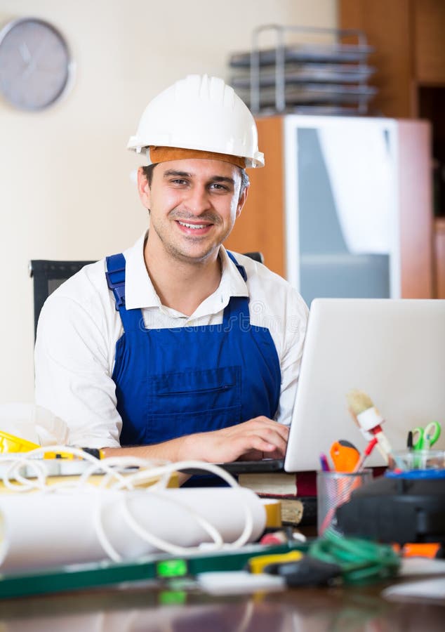 Constructor with Tools and Blueprints in Office Stock Image - Image of ...