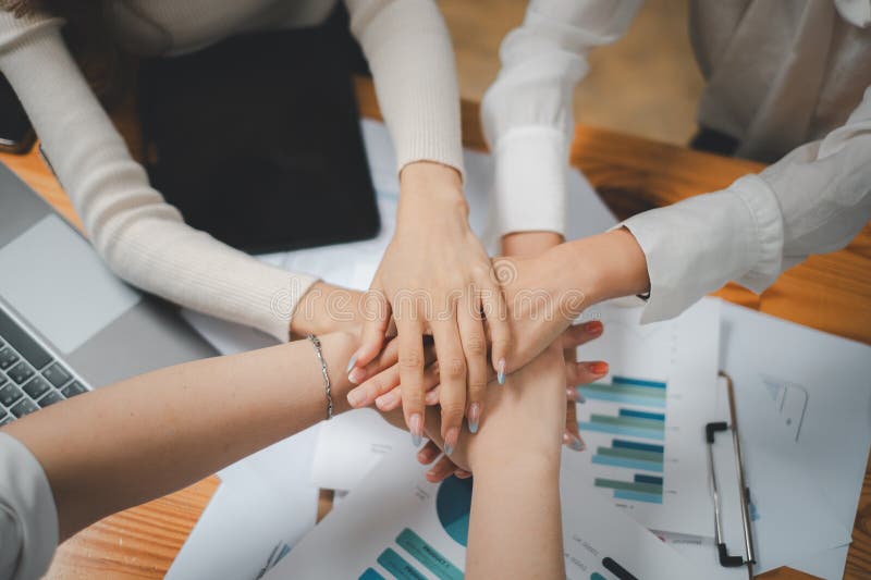 Positive Diverse Business Team Putting Their Hands on Top of Each Other ... Positive Diverse Business Team Putting Their Hands on Top of Each Other ...