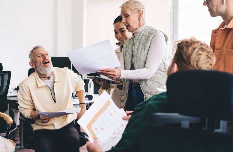 Positive Diverse Colleagues Working with Documents in Office Stock ...