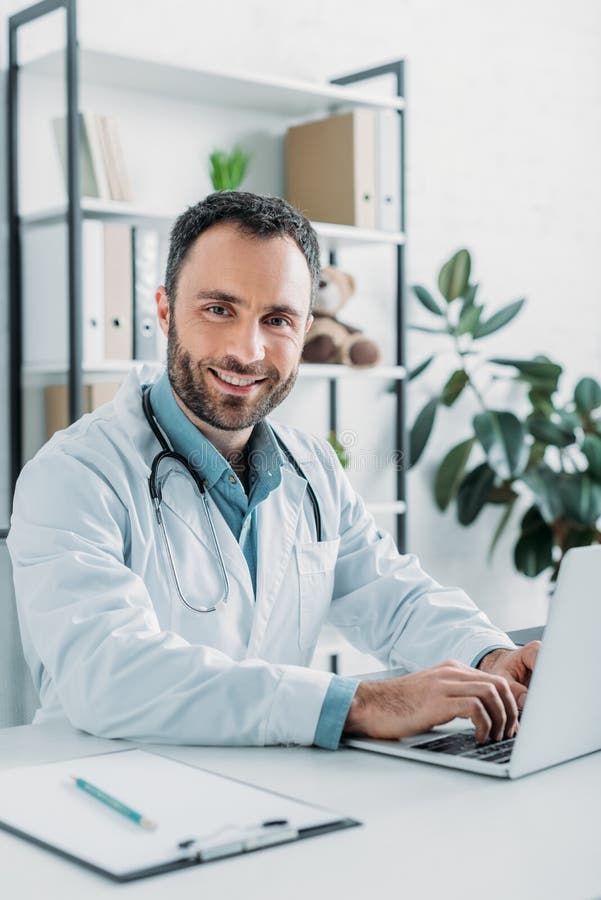 Positive Doctor Looking at Camera while Stock Photo - Image of ...