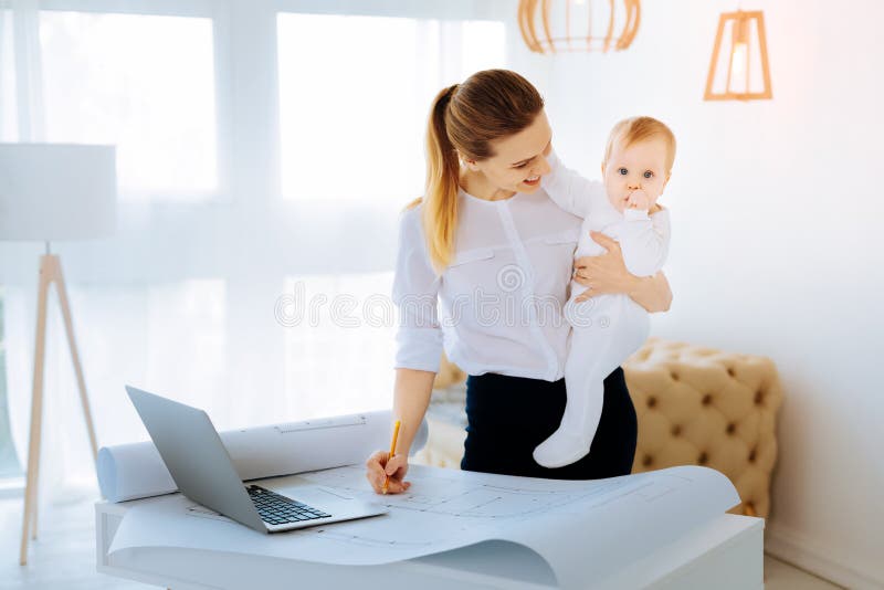 Positive Engineer Looking Softly at the Baby Stock Image - Image of ...