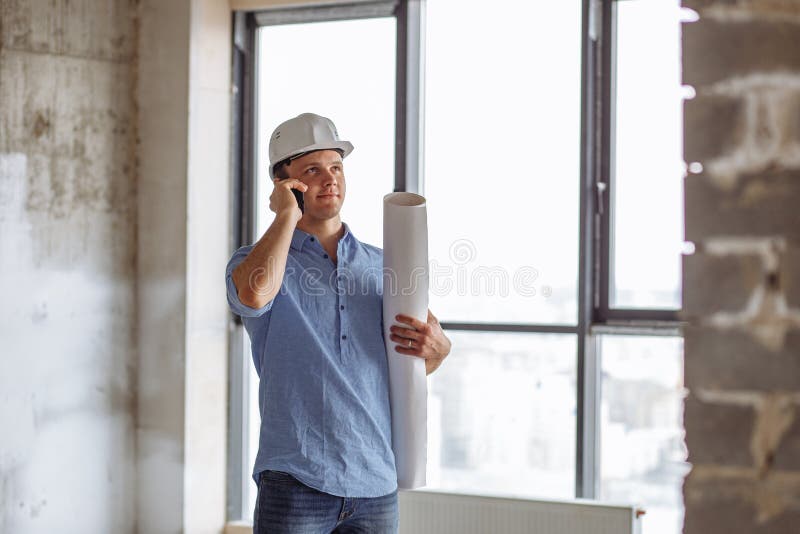 Positive Engineer is Talking on the Smart Phone Stock Image - Image of ...