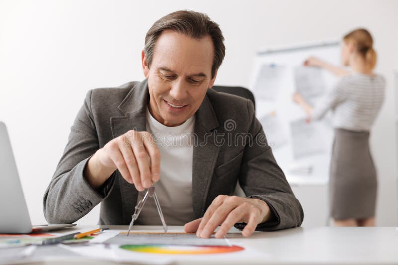 Positive Engineer Using Compasses while Drawing Stock Image - Image of ...