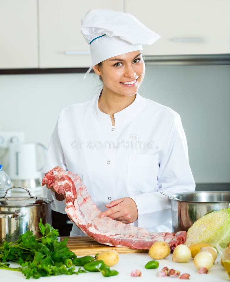 Positive Female Chef Working with Pork Ribs Stock Photo - Image of ...