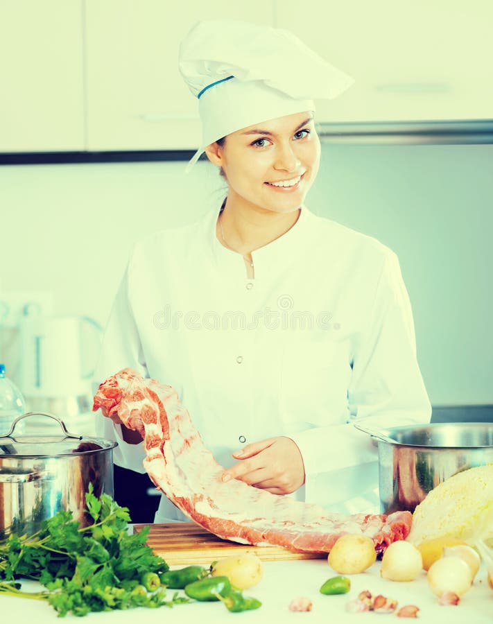 Positive Female Chef Working with Pork Ribs Stock Image - Image of ...