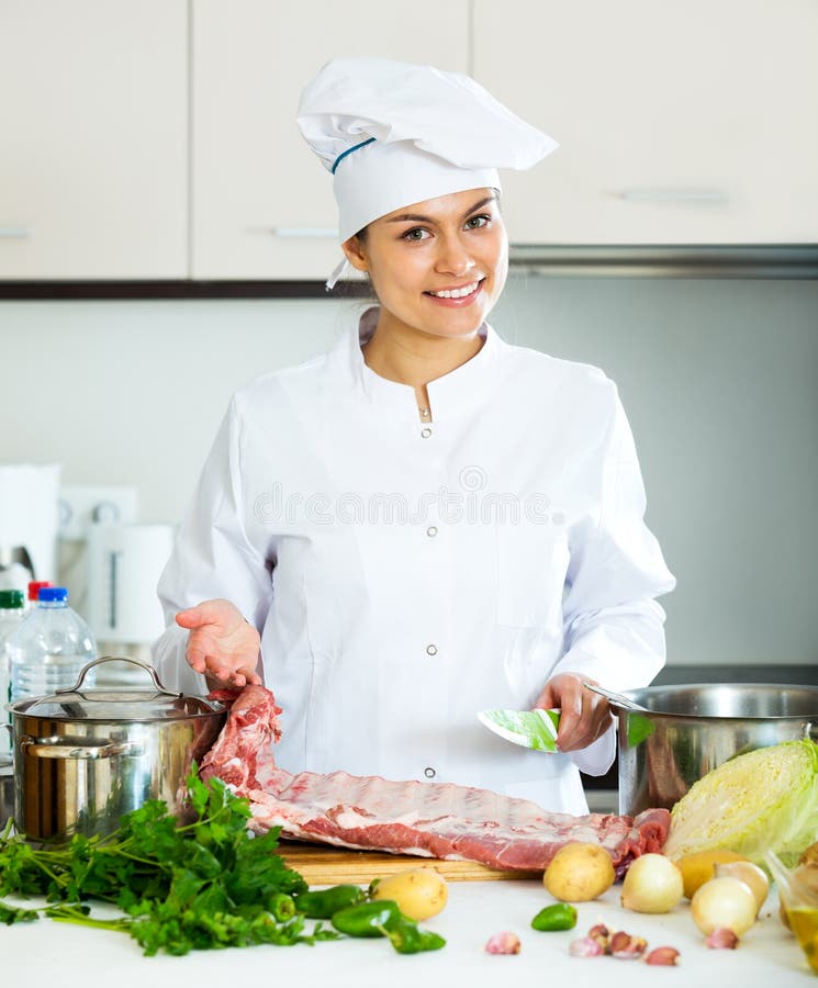 Positive Female Chef Working with Pork Ribs Stock Image - Image of ...