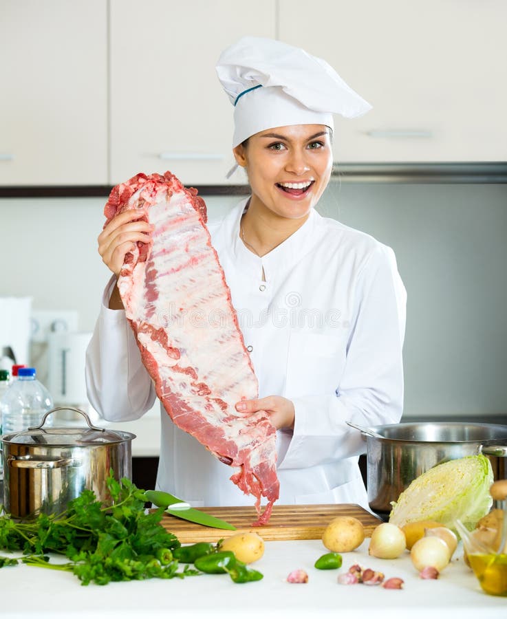 Positive Female Chef Working with Pork Ribs Stock Photo - Image of ...