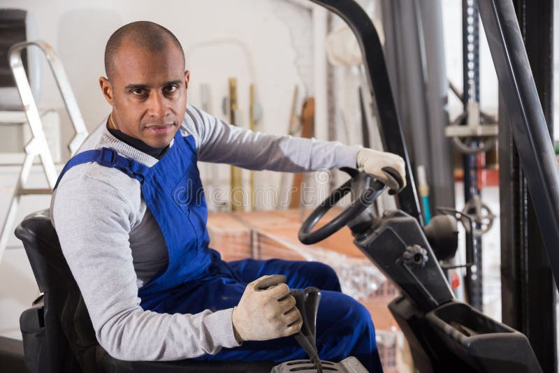 Forklift Driver Driving at Hardware Store Stock Photo - Image of ...