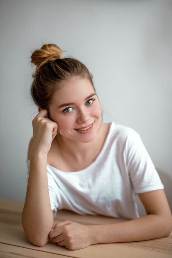 A Positive Girl with Hairbun Looking at the Camera Stock Image - Image ...