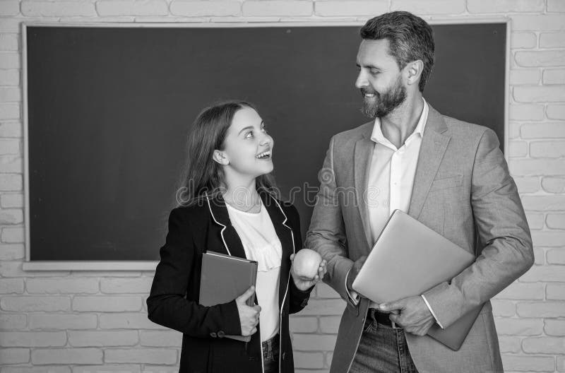 Positive Girl with Man Teacher in Classroom. Education Stock Image ...