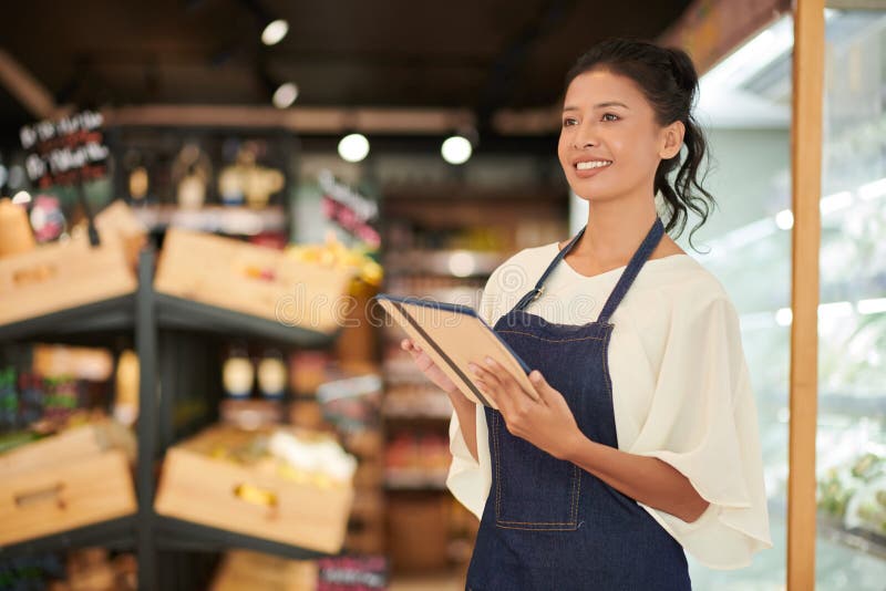 Positive Grocery Store Worker Stock Photo - Image of woman, smiling ...