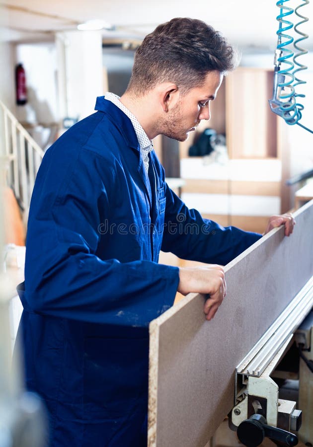Positive Guy Fixing Chipboard on Table at Workshop Stock Photo - Image ...