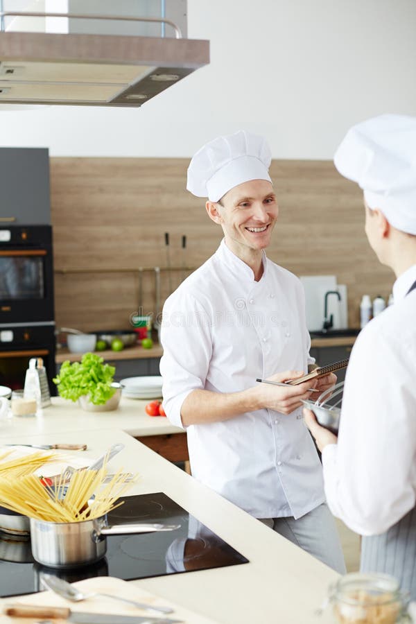 Positive Chef Teaching Young Cook Stock Photo - Image of quality, adult ...