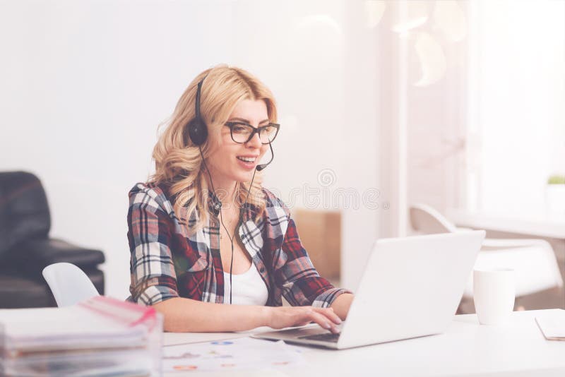 Positive Helpful Support Operator Sitting at the Table Stock Photo ...