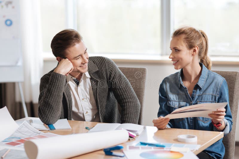Positive Joyful Colleagues Sitting at the Table Stock Image - Image of ...
