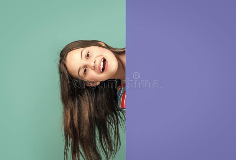 Positive Kid Behind Blank Blue Paper with Copy Space for Advertisement ...