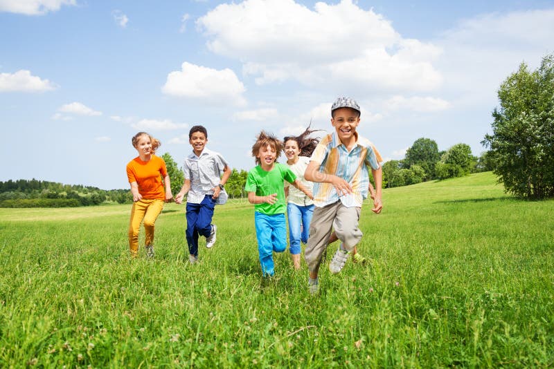 Positive Kids Play and Run Together in the Field Stock Photo - Image of ...