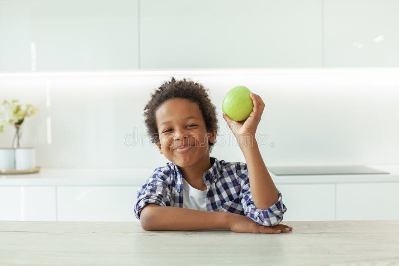 Positive Little Boy with Fresh Green Apple Looking at Camera Stock ...