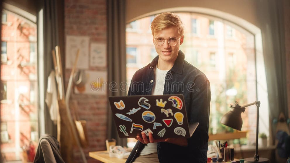 Positive Male Software Engineer Coding on Laptop Computer and Working ...