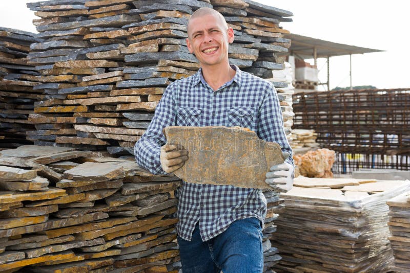 Male Worker Checking Quantity of Natural Stone Tiles in Warehouse Stock ...